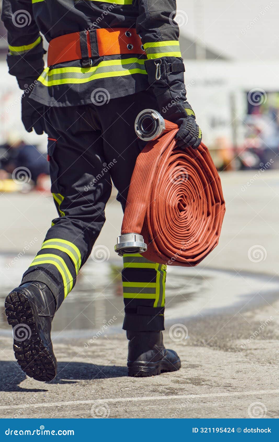 In a Dynamic Display of Synchronized Teamwork, Firefighters Hustle To ...