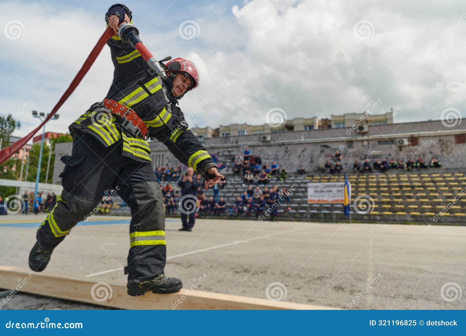 In a Dynamic Display of Synchronized Teamwork, Firefighters Hustle To ...