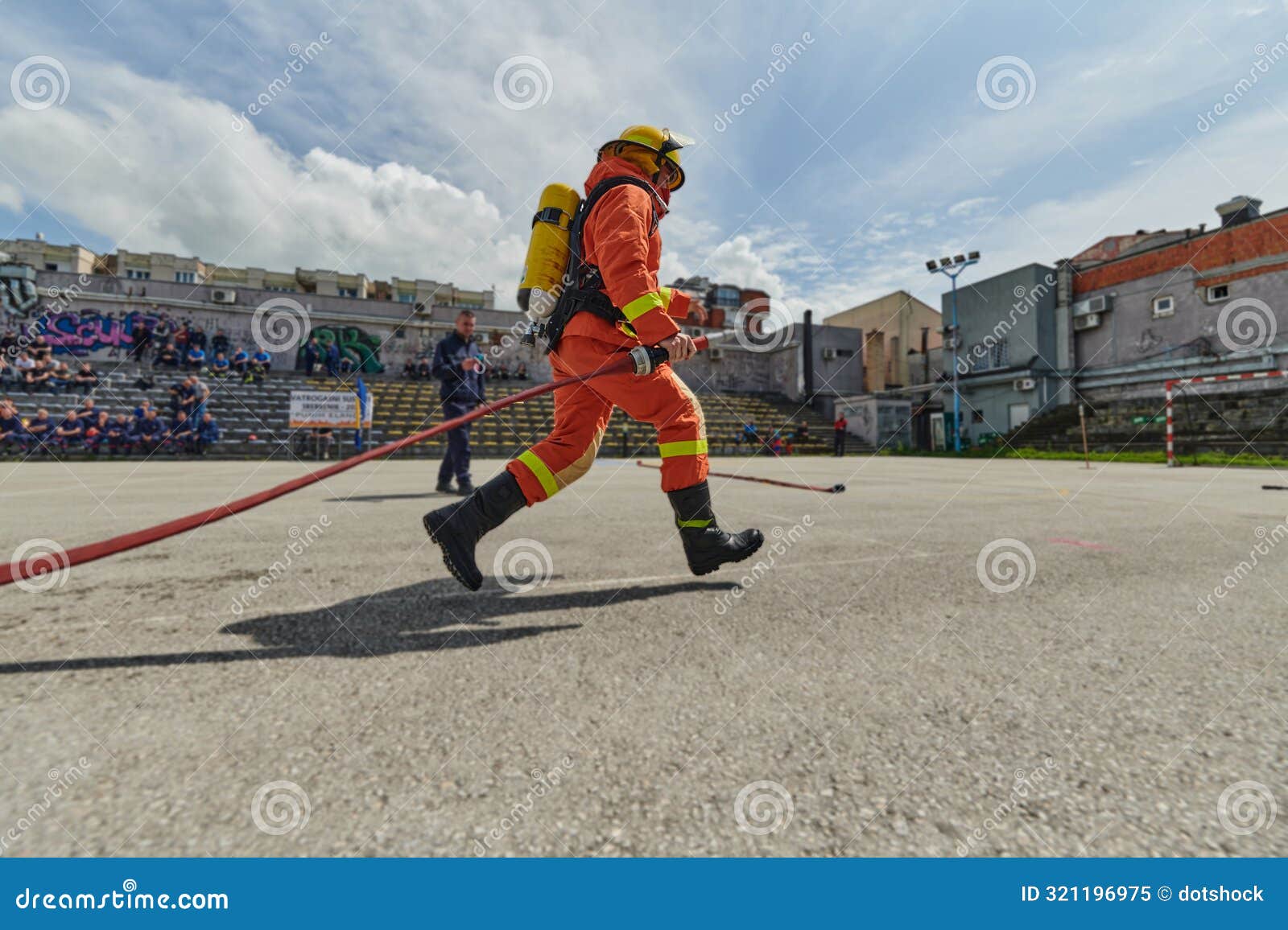 In a Dynamic Display of Synchronized Teamwork, Firefighters Hustle To ...