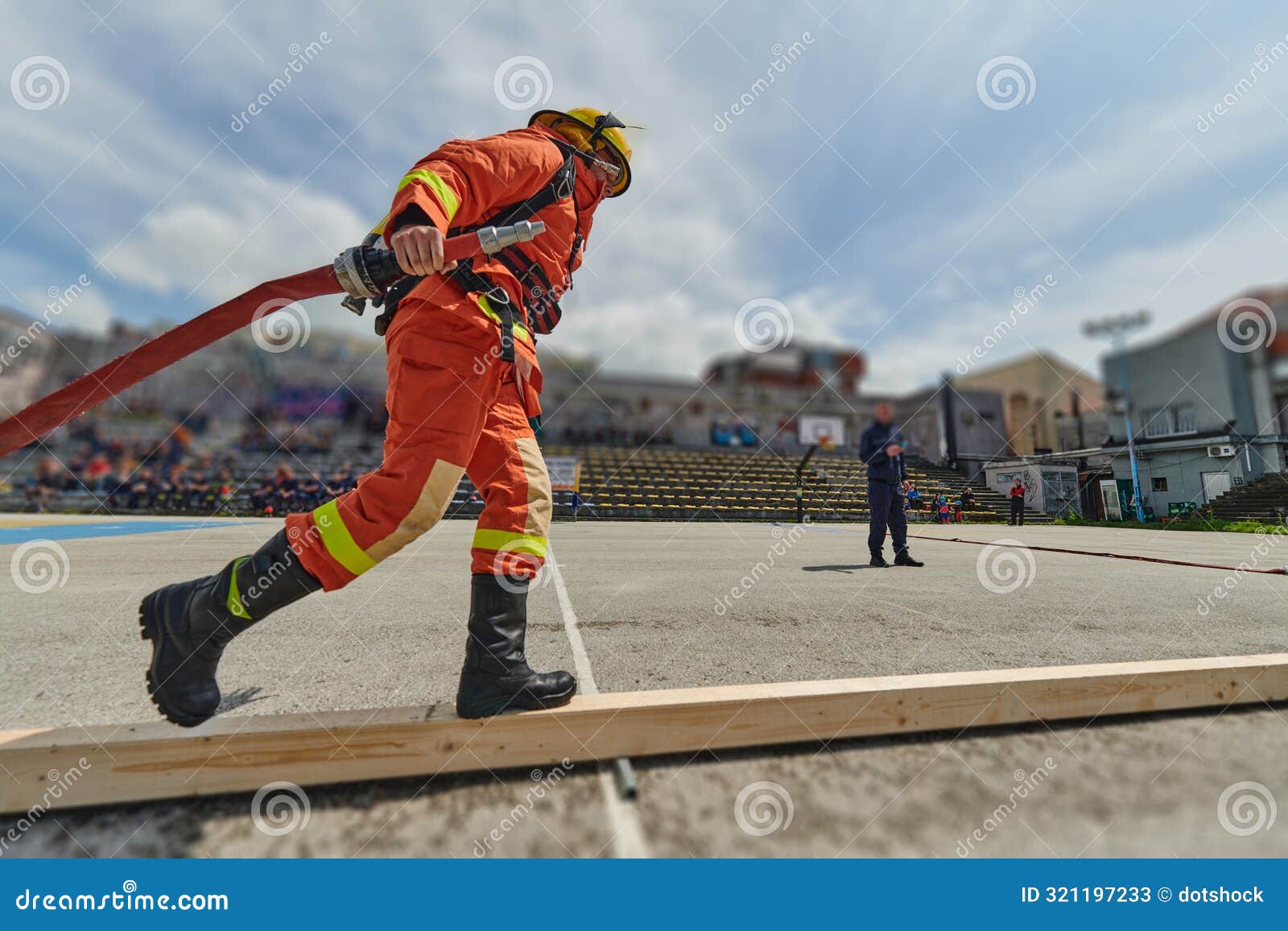 In a Dynamic Display of Synchronized Teamwork, Firefighters Hustle To ...
