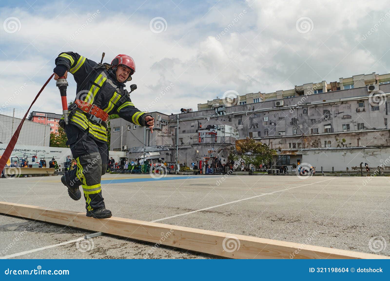 In a Dynamic Display of Synchronized Teamwork, Firefighters Hustle To ...