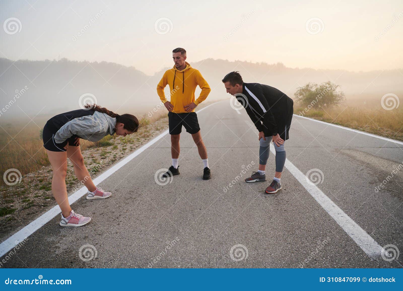 Diverse Athletic Warm-Up: Group Prepares for Intense Running Challenge ...