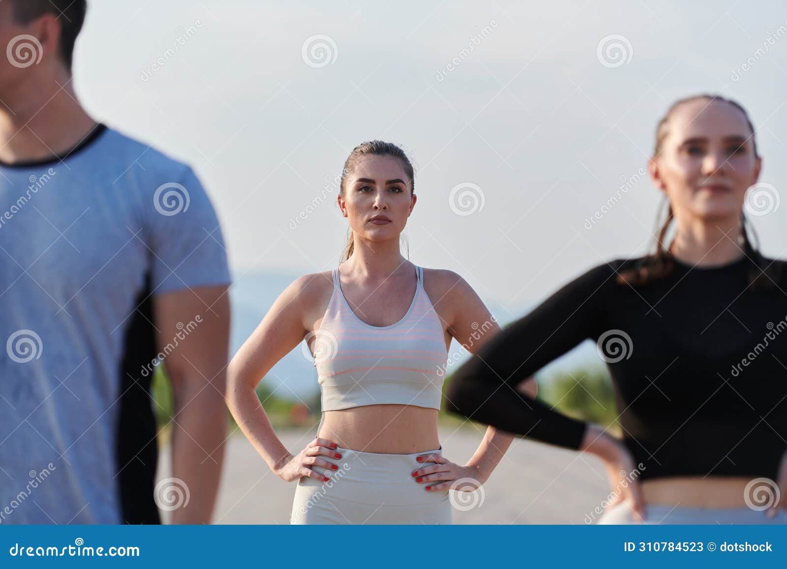 Diverse Athletic Warm-Up: Group Prepares for Intense Running Challenge ...