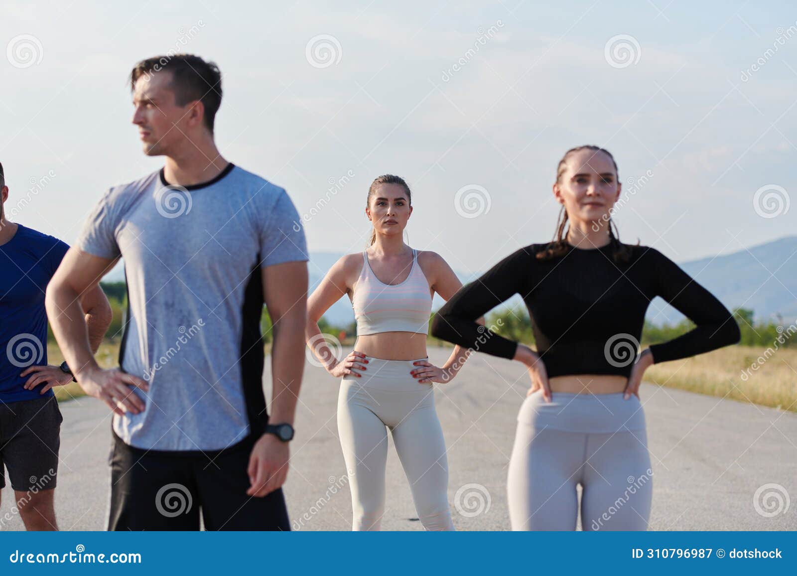 Diverse Athletic Warm-Up: Group Prepares for Intense Running Challenge ...