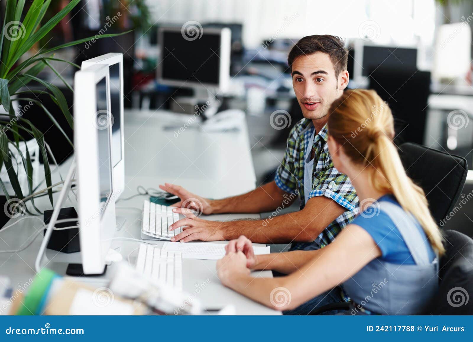 The Dynamic Duo. Two Colleagues Working on a Computer Together. Stock ...