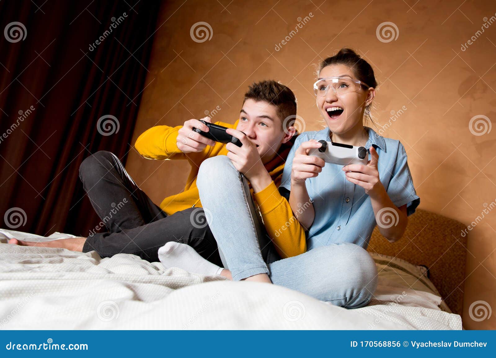 Dynamic Game of Two Young People in a Computer Console Stock Photo ...