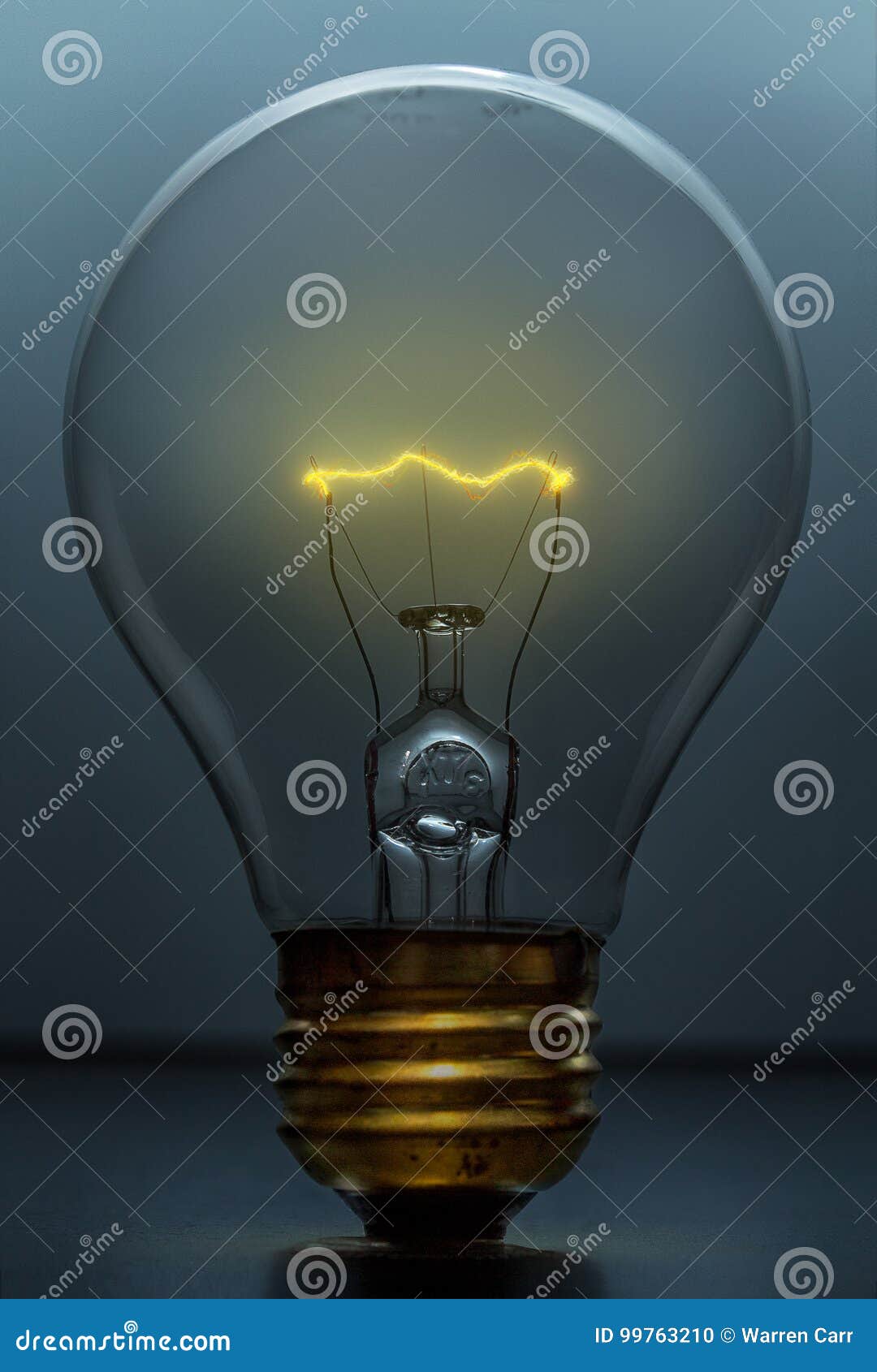 Light Bulb Lit on Blue Background Stock Photo - Image of light ...