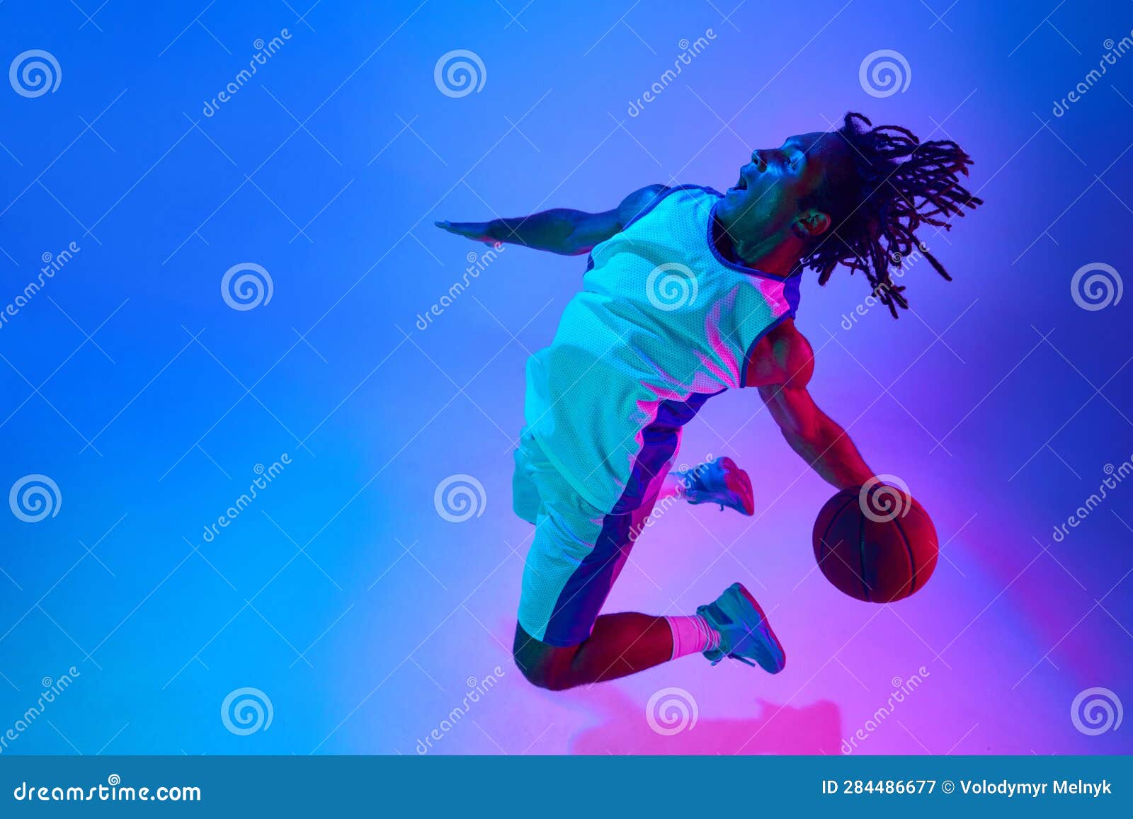 Dynamic Image of Professional Basketball Player in a Jump with Ball ...
