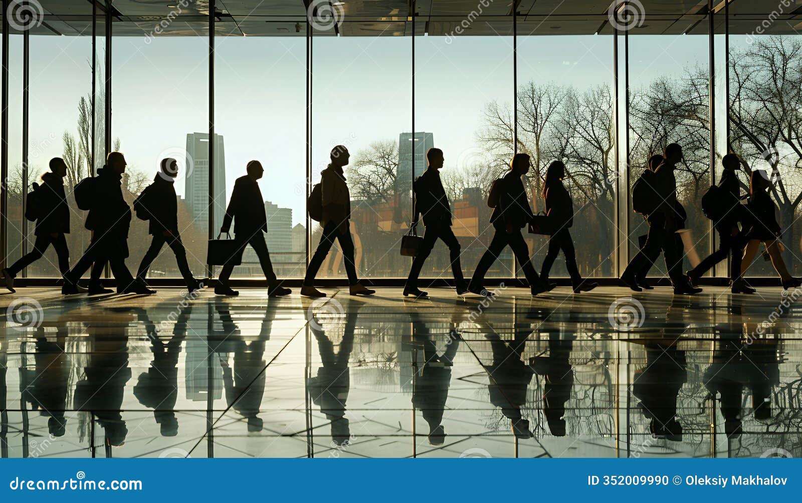 Dynamic Image of Silhouettes of Businesspeople Walking in a Modern ...