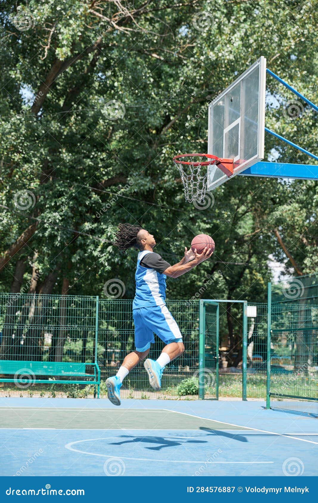 Dynamic Image of Young Man, Basketball Player in Motion, Throwing Ball ...