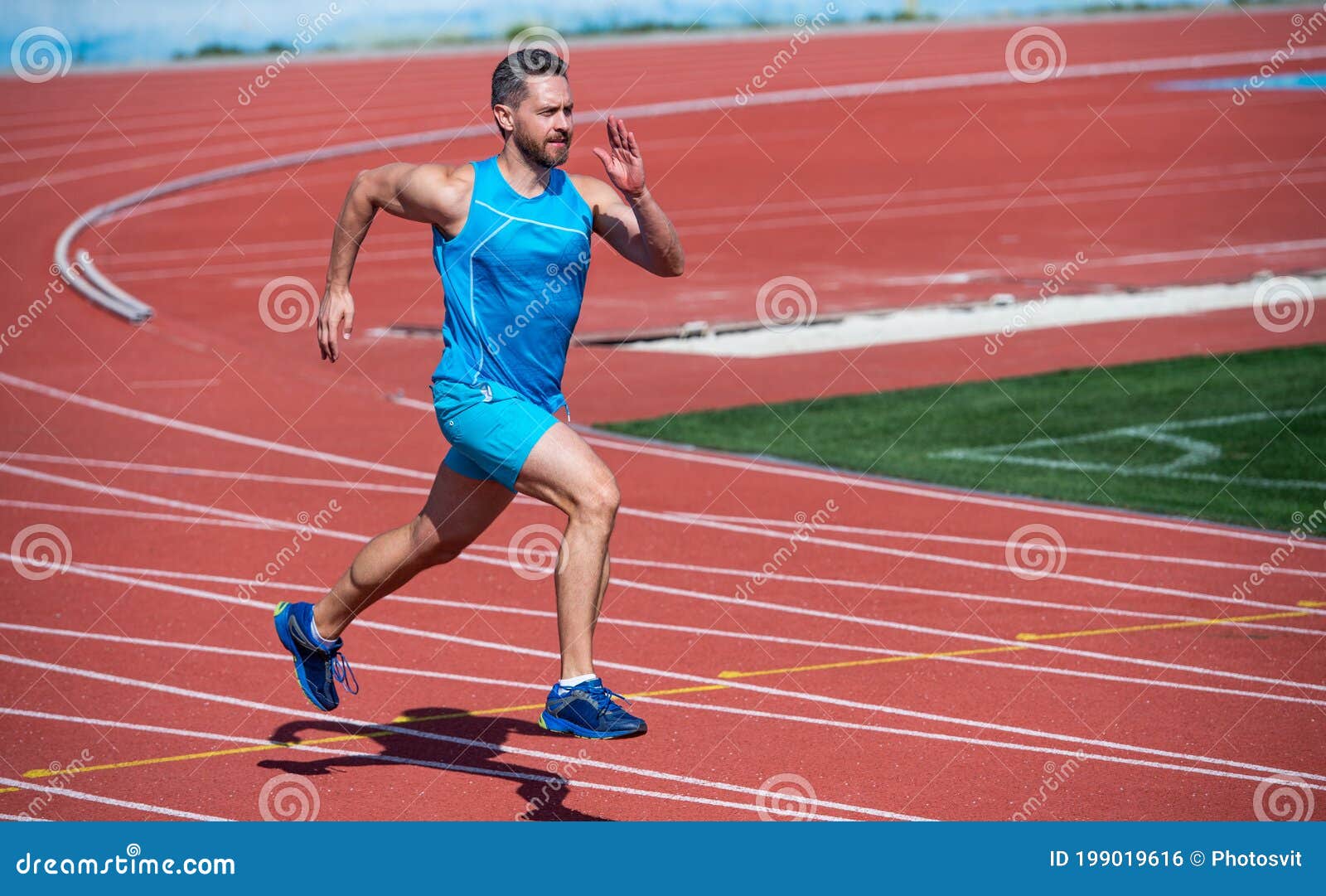 Dynamic Movement of Male Runner on Running Track, Run Stock Photo ...