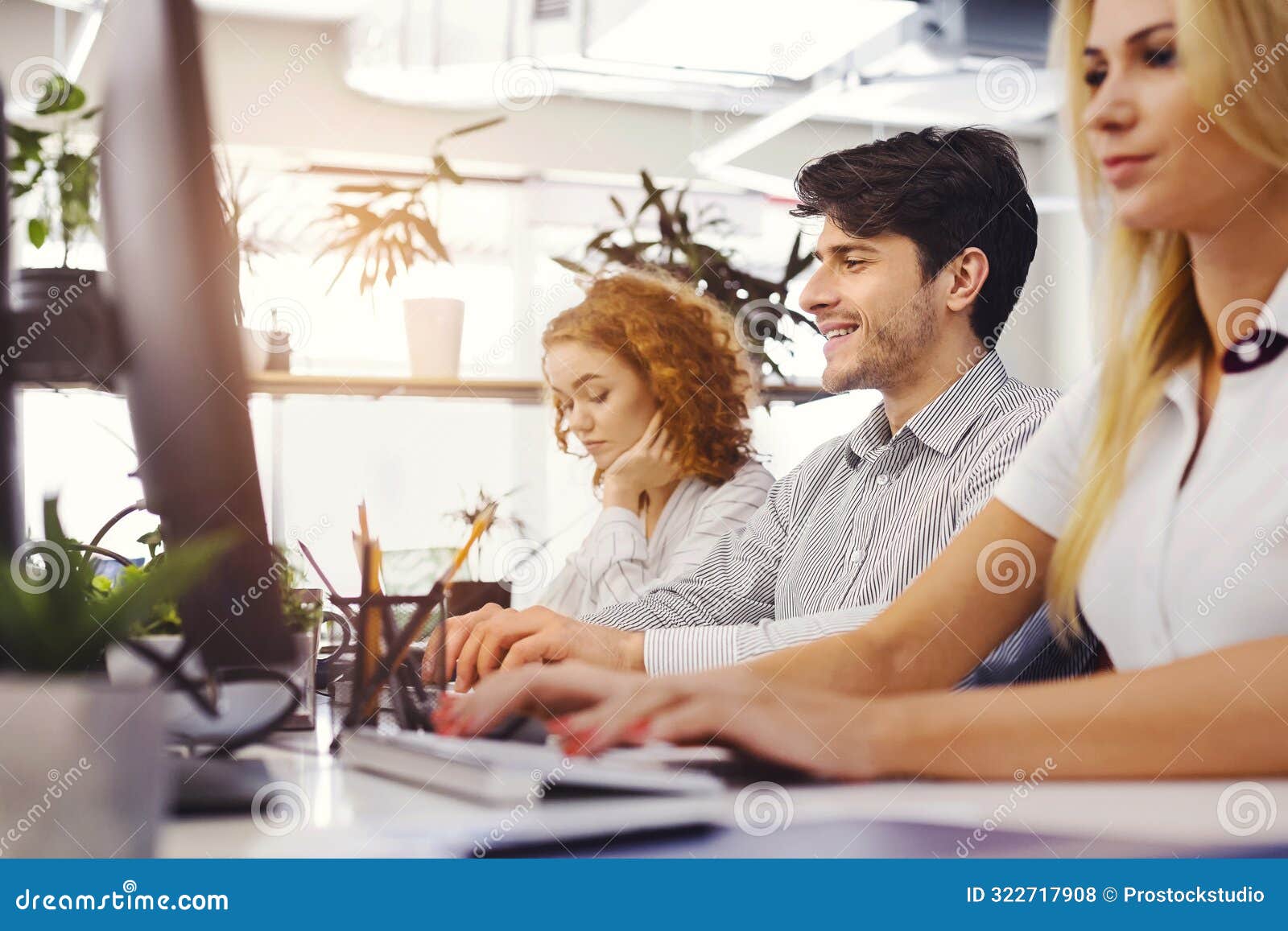 Dynamic Office with Modern Equipment and Focused Workers Stock Photo ...