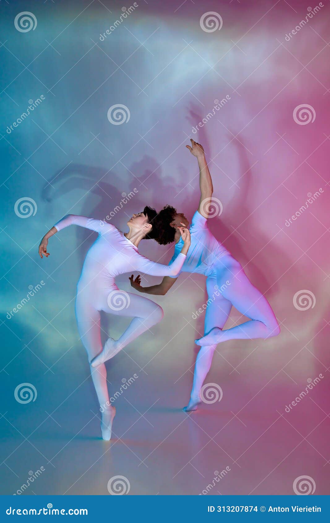 Dynamic Portrait of Two Ballet Dancers in White Leotards Expressing ...