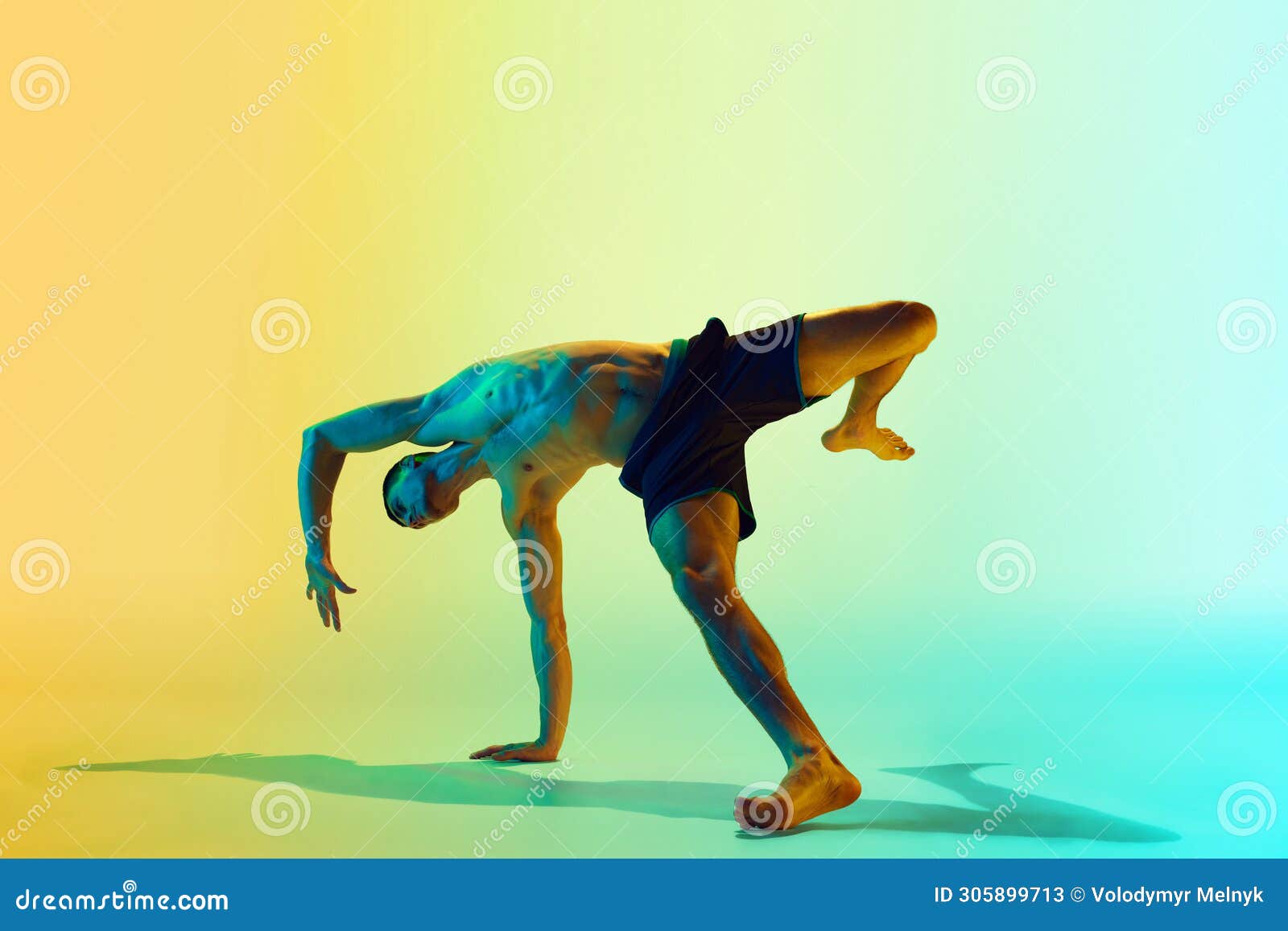 Dynamic Pose. Muscular, Athletic Young Man Training Shirtless ...