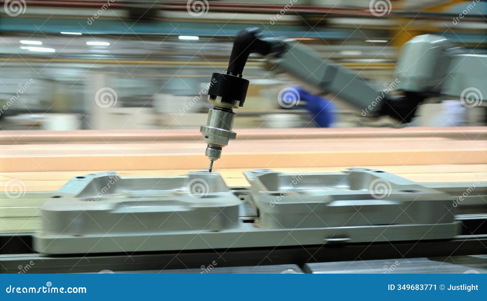 A Dynamic Shot of a Robotic Arm Precisely Aligning Two Halves of a Mold ...