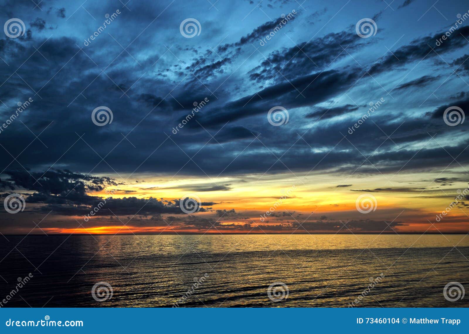 A dynamic sky sunset stock photo. Image of ocean, colorful - 73460104