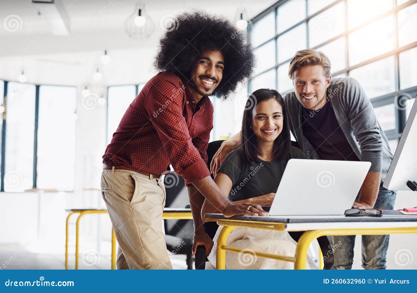Dynamic Trio of Creatives. a Group of Creative Designers Hard at Work ...