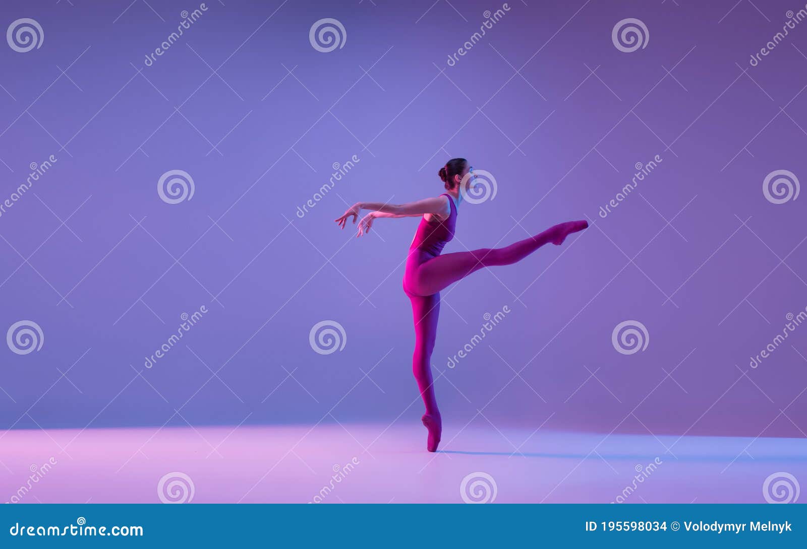 Young and Graceful Ballet Dancer Isolated on Purple Studio Background ...