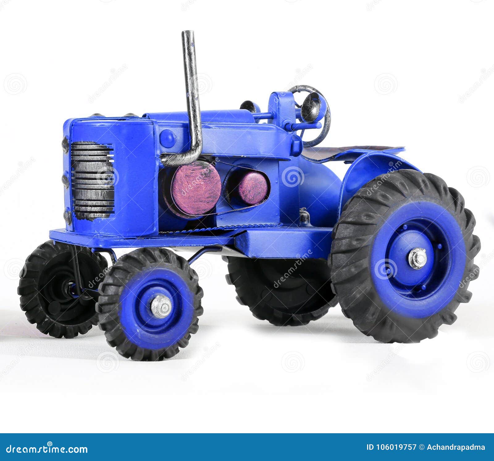 Blue Toy Tractor on White immagine stock. Immagine di azionamento ...