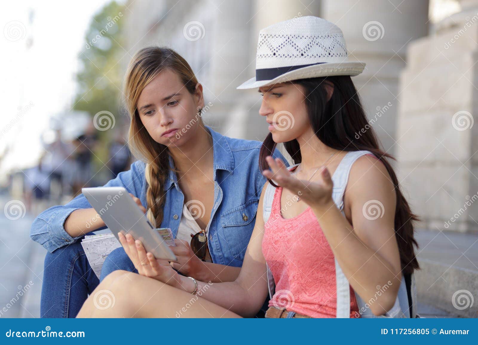 Lost and Confused Girl Friends Looking for Directions on Map Stock ...