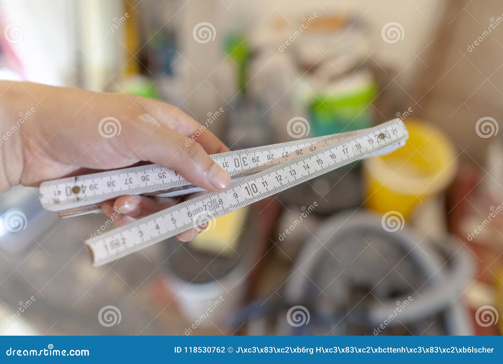 Hand Holds a German Double Meter Stick on a Construction Site Arkivfoto ...