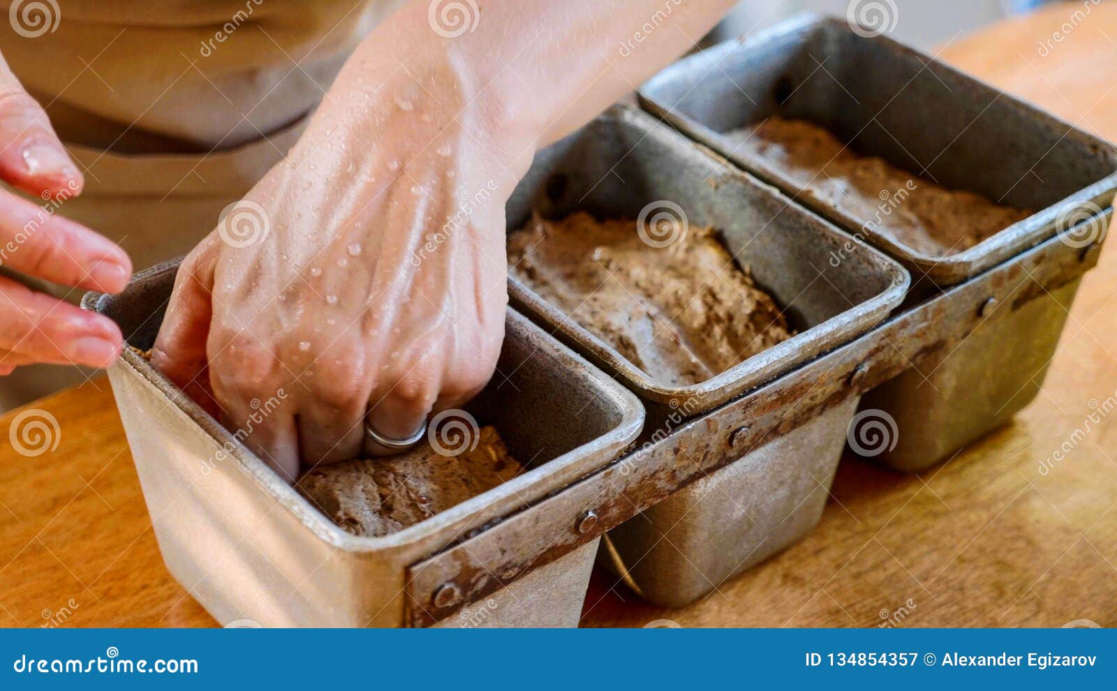 Close-up of Young Woman Pressing Dough in Baking Form for Bread 库存图片 ...