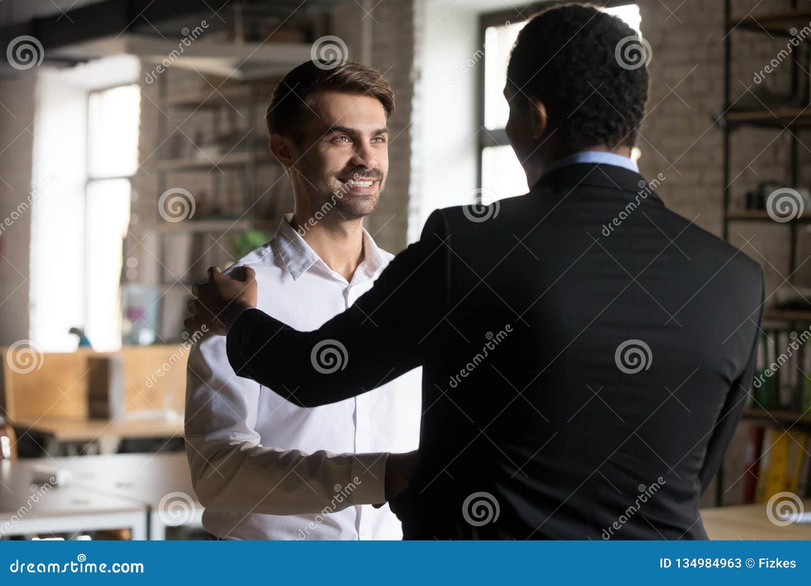 Happy Caucasian Employee Getting Rewarded Shaking Hand of Black Imagem ...