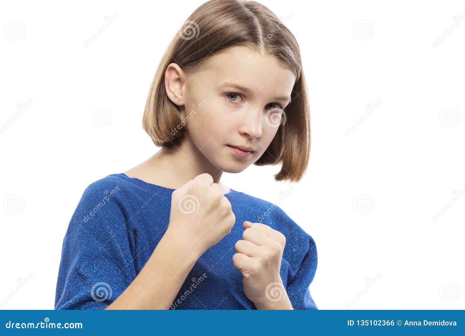 Cute Teen Girl with Fists Up Close Stockfoto - Bild von kreuz ...