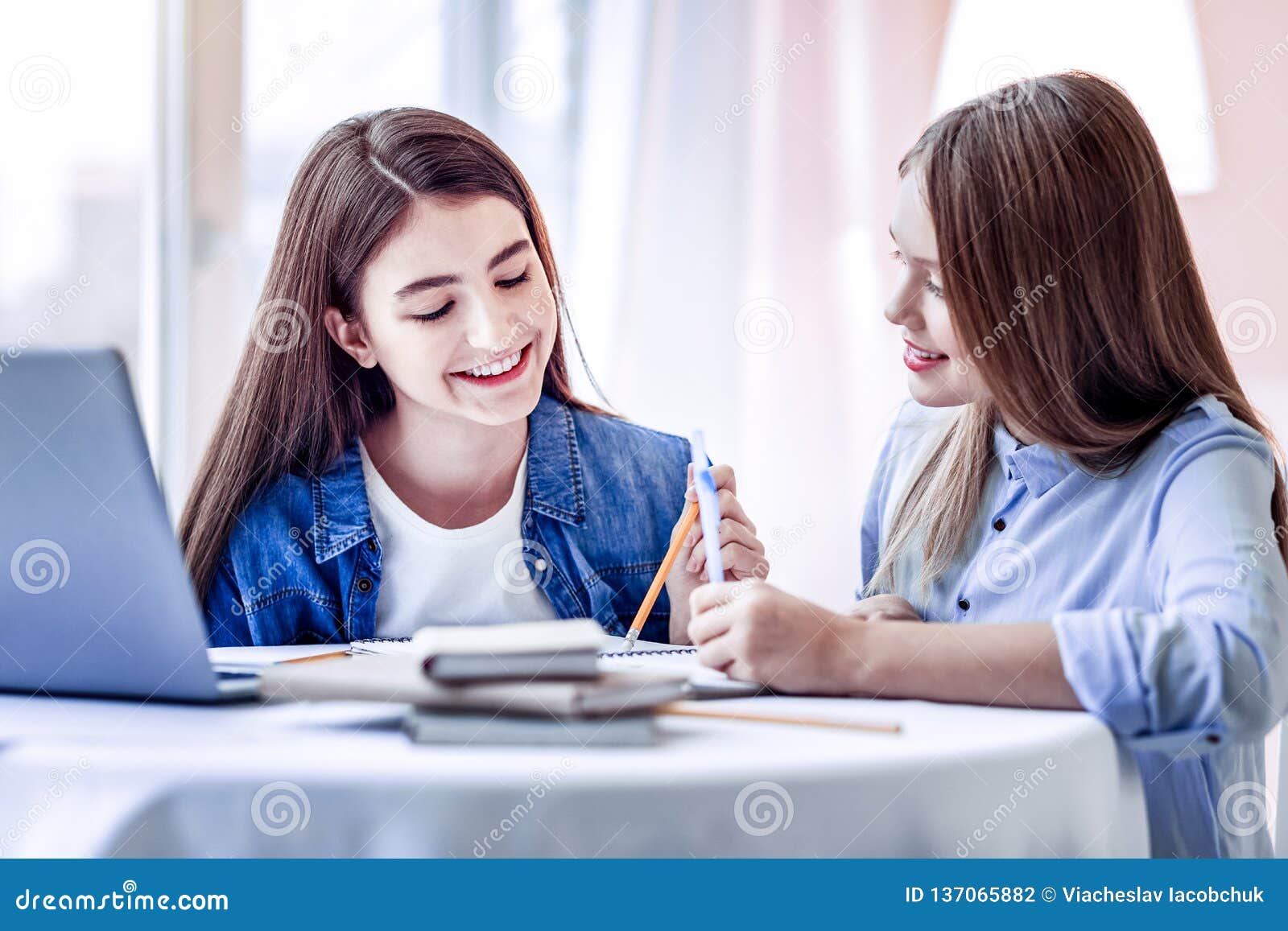 Cheerful Jolly Two Girls Discussing Home Assignment Arkivfoto - Bild av ...