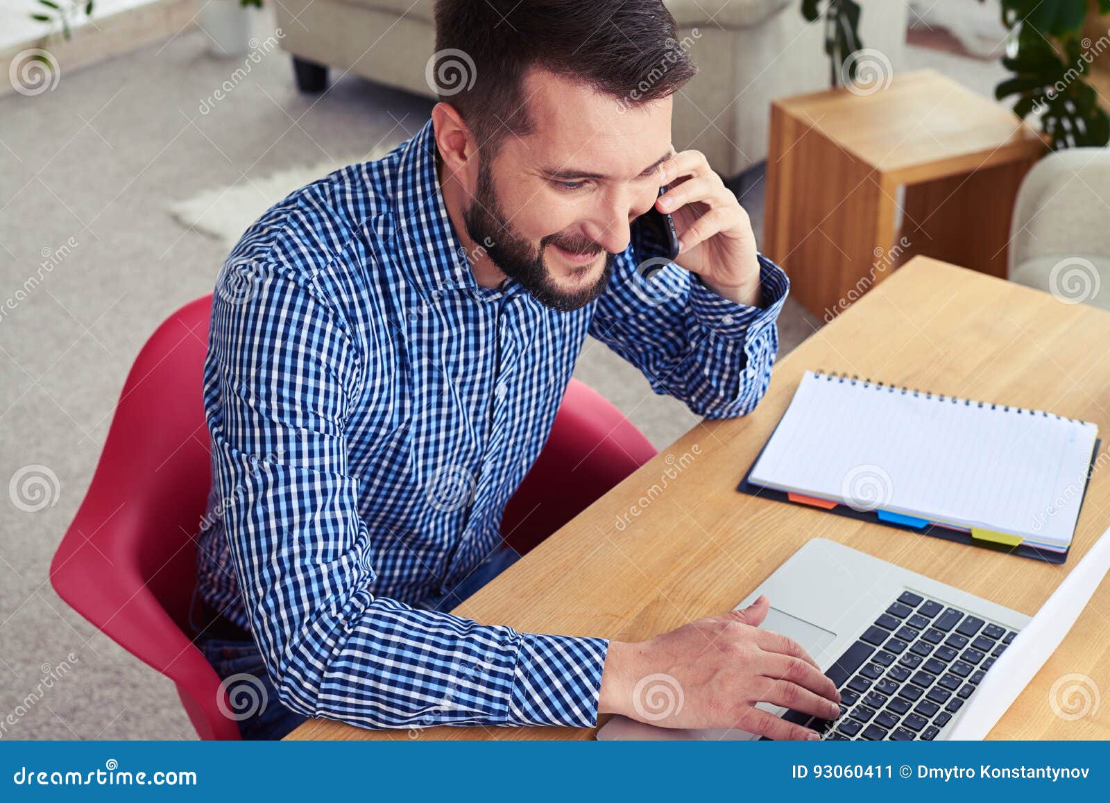 Attractive Gentleman Talking on Telephone while Working in Laptop ...