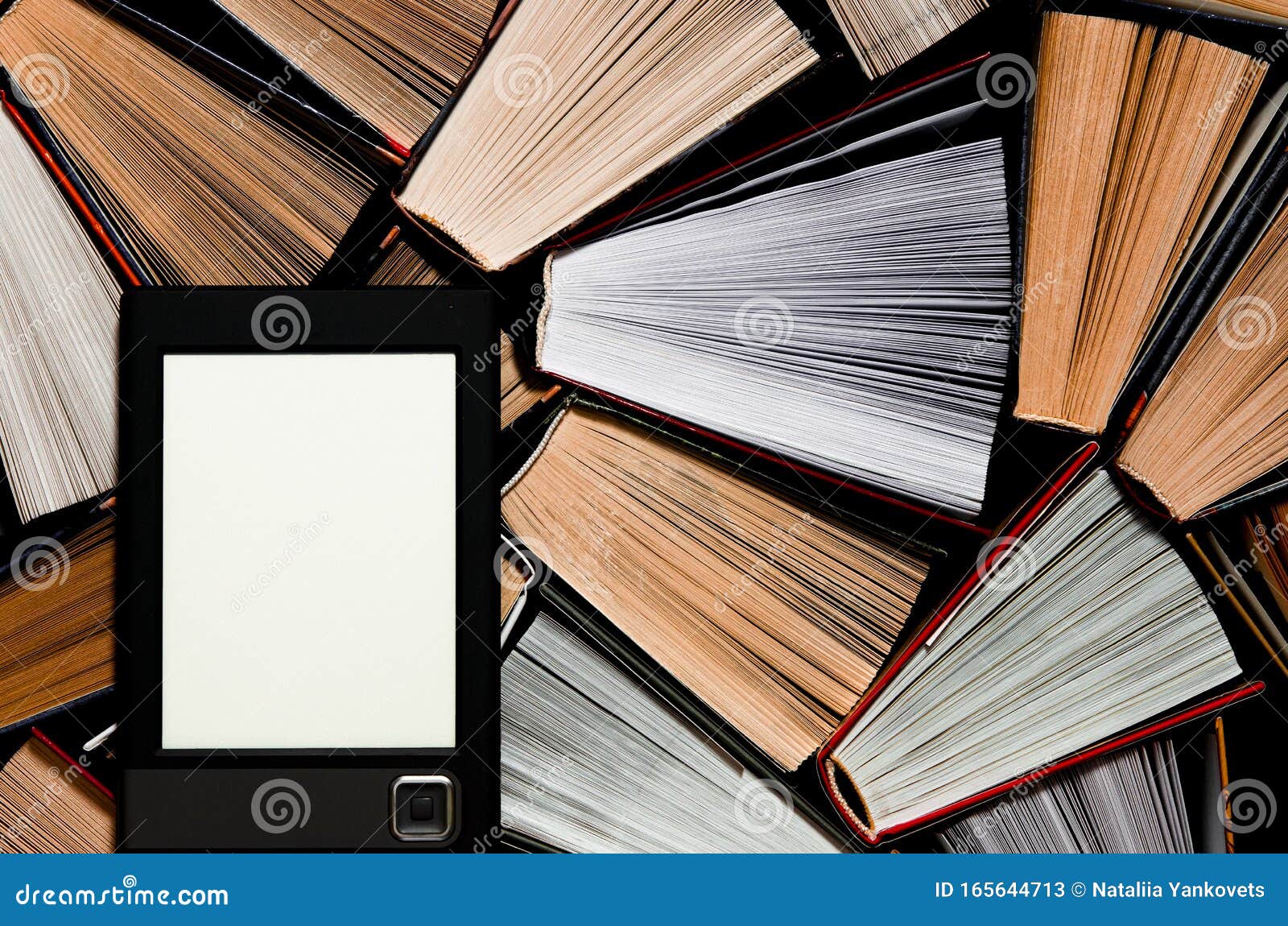 The E-book with a Clean White Screen Rests on the Open Multi-colored ...
