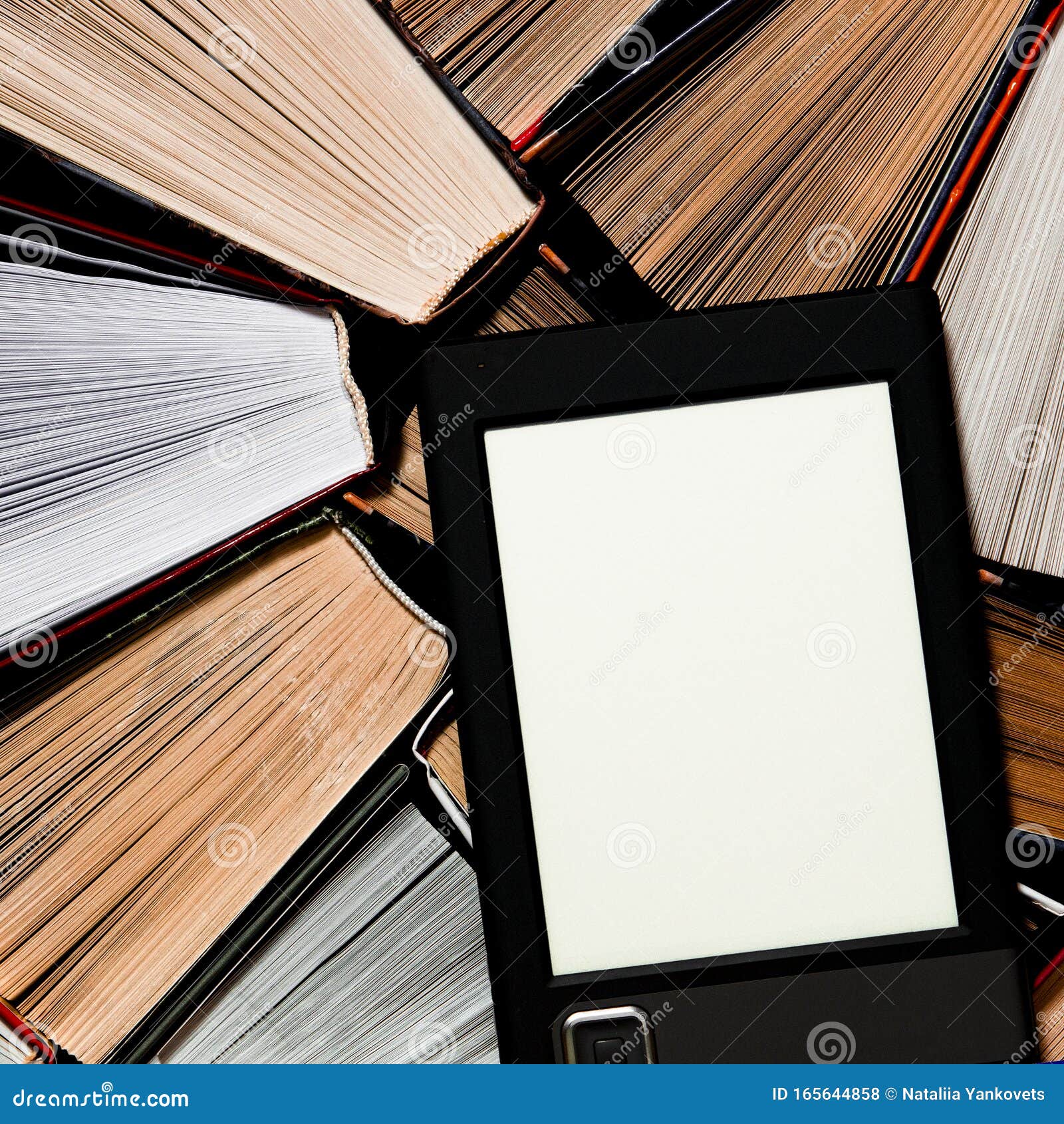 The E-book with a Clean White Screen Rests on the Open Multi-colored ...