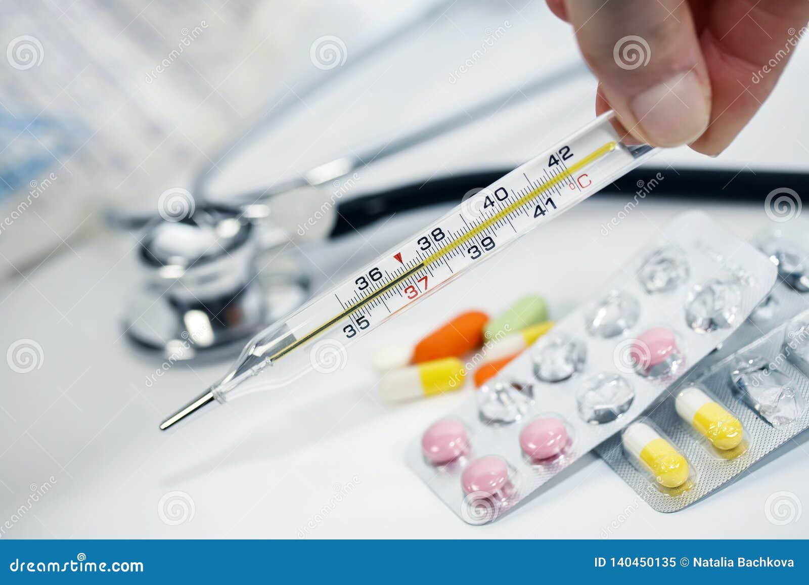 Medical Glass Thermometer in the Hands of the Temperature on the ...