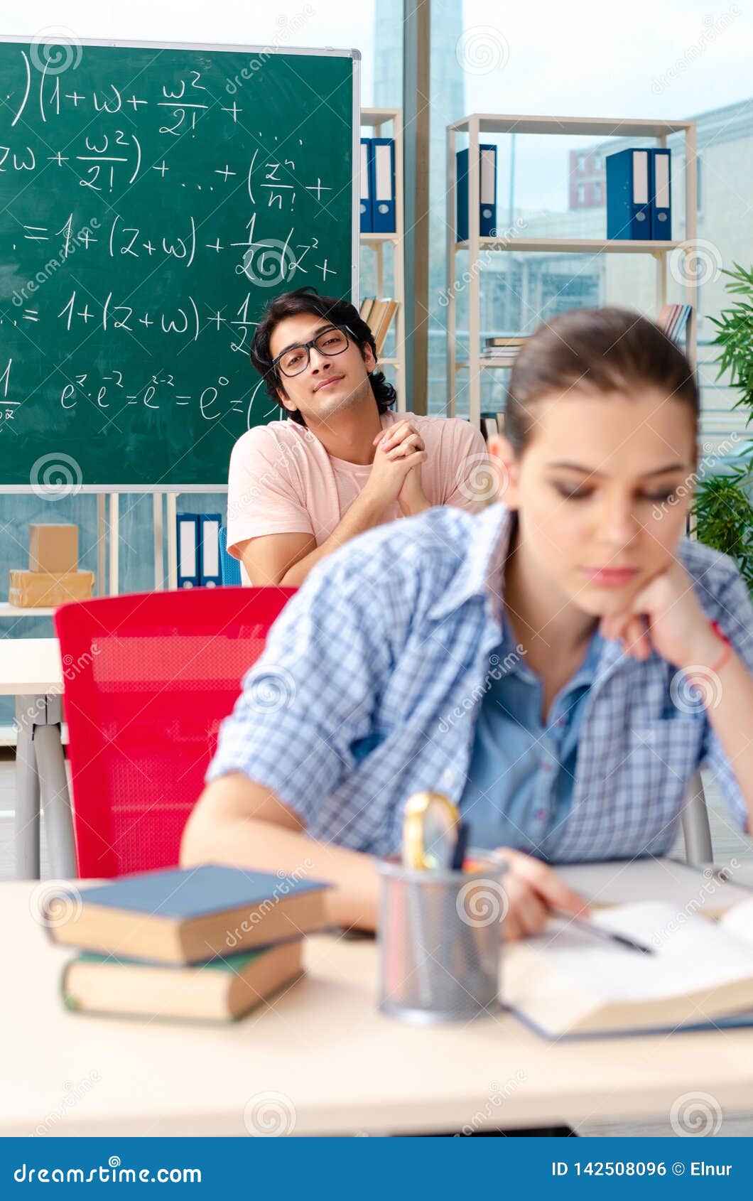 The Young Students Taking the Math Exam in Classroom Foto de Stock ...