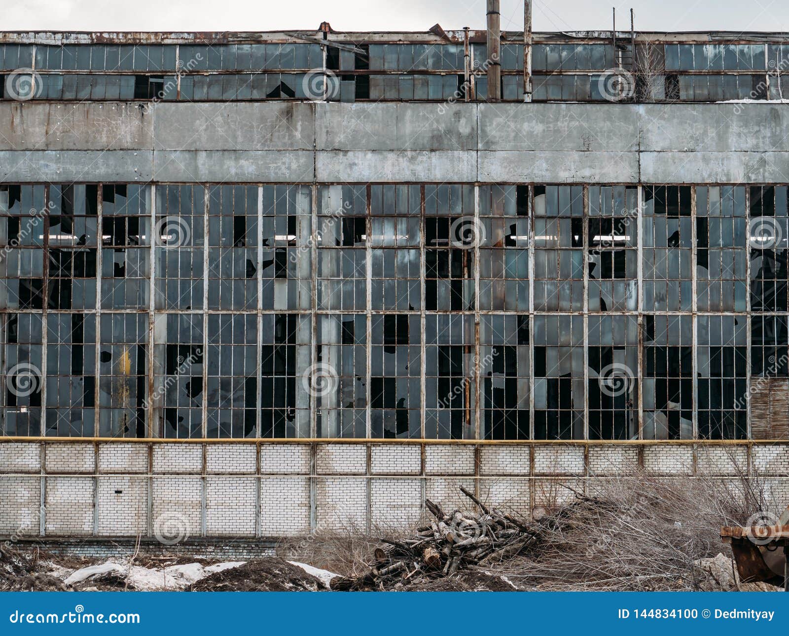 Wall with Large Broken Windows in Abandoned Ruined Factory Building ...