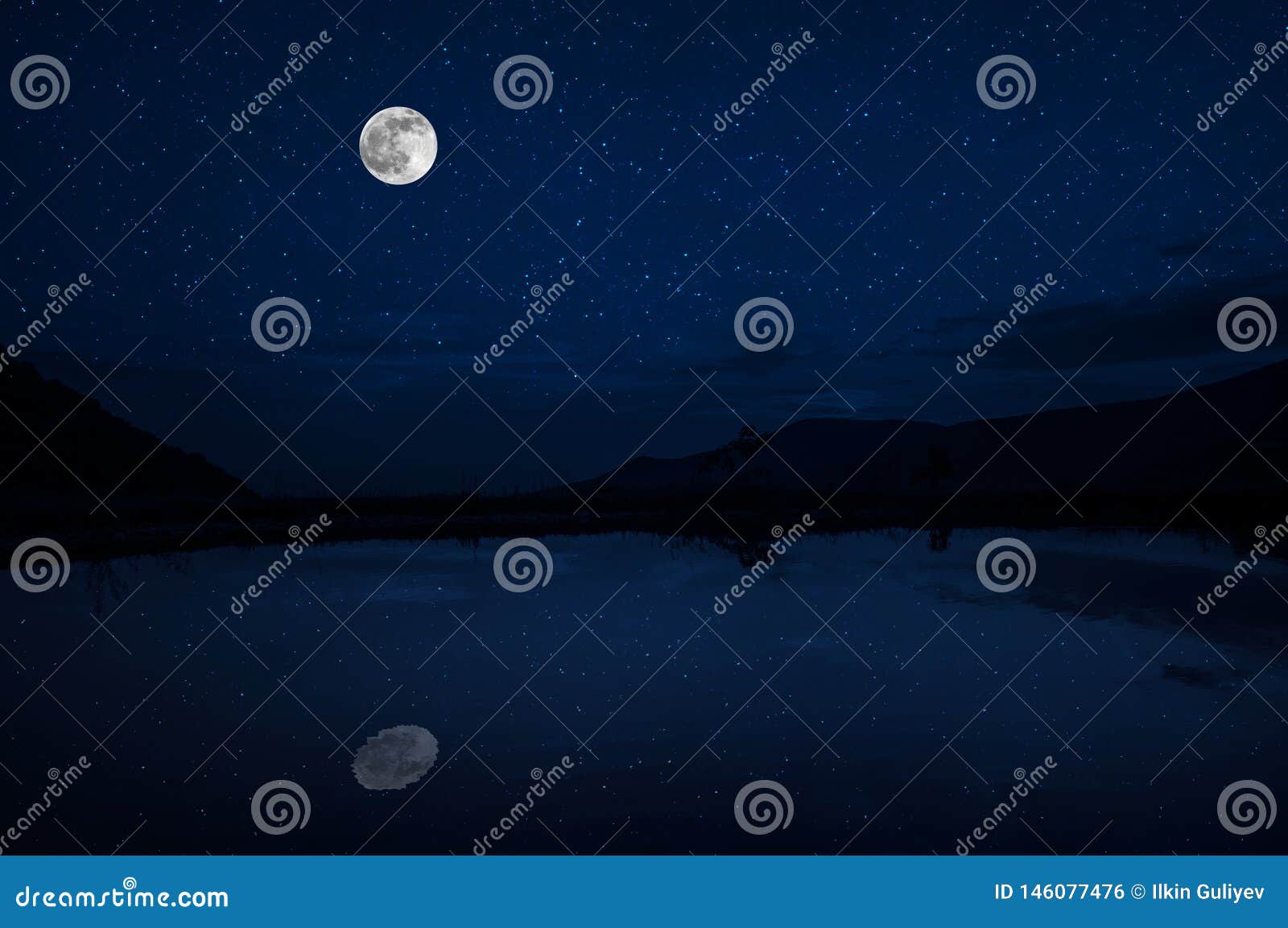 This Dramatic Moon Rise in a Deep Blue Night Time Sky is Accented by ...