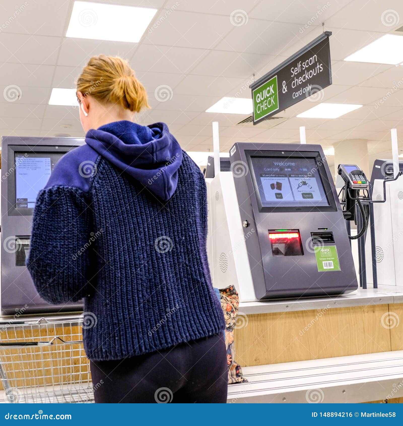 Woman Making Payment at an Automatic Check Out in Waitrose Supermarket ...