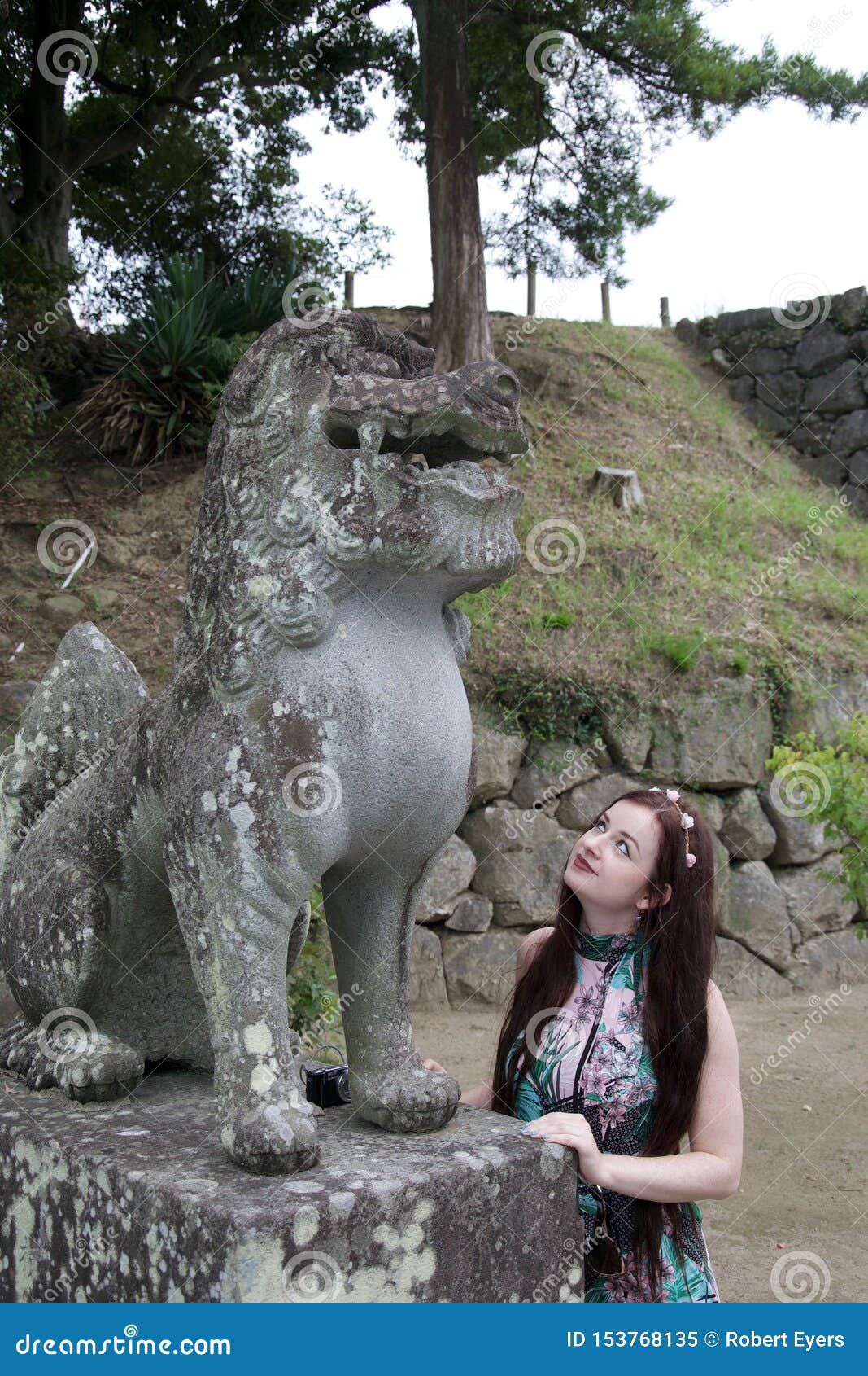Brunette Caucasian Hippie Girl Admiring Ancient Damaged Japanese Statue ...