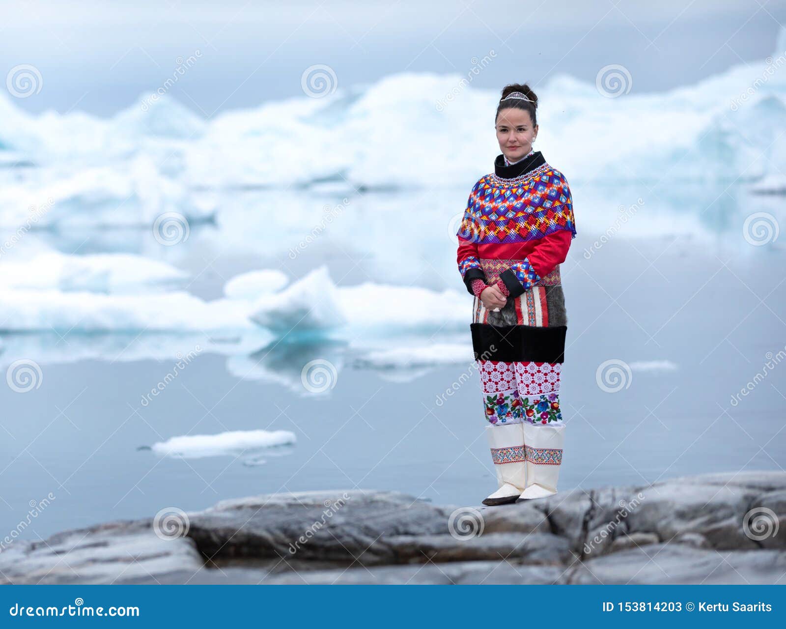 Young Inuit Woman in Traditional Clothing Posing for Photos in a Small ...