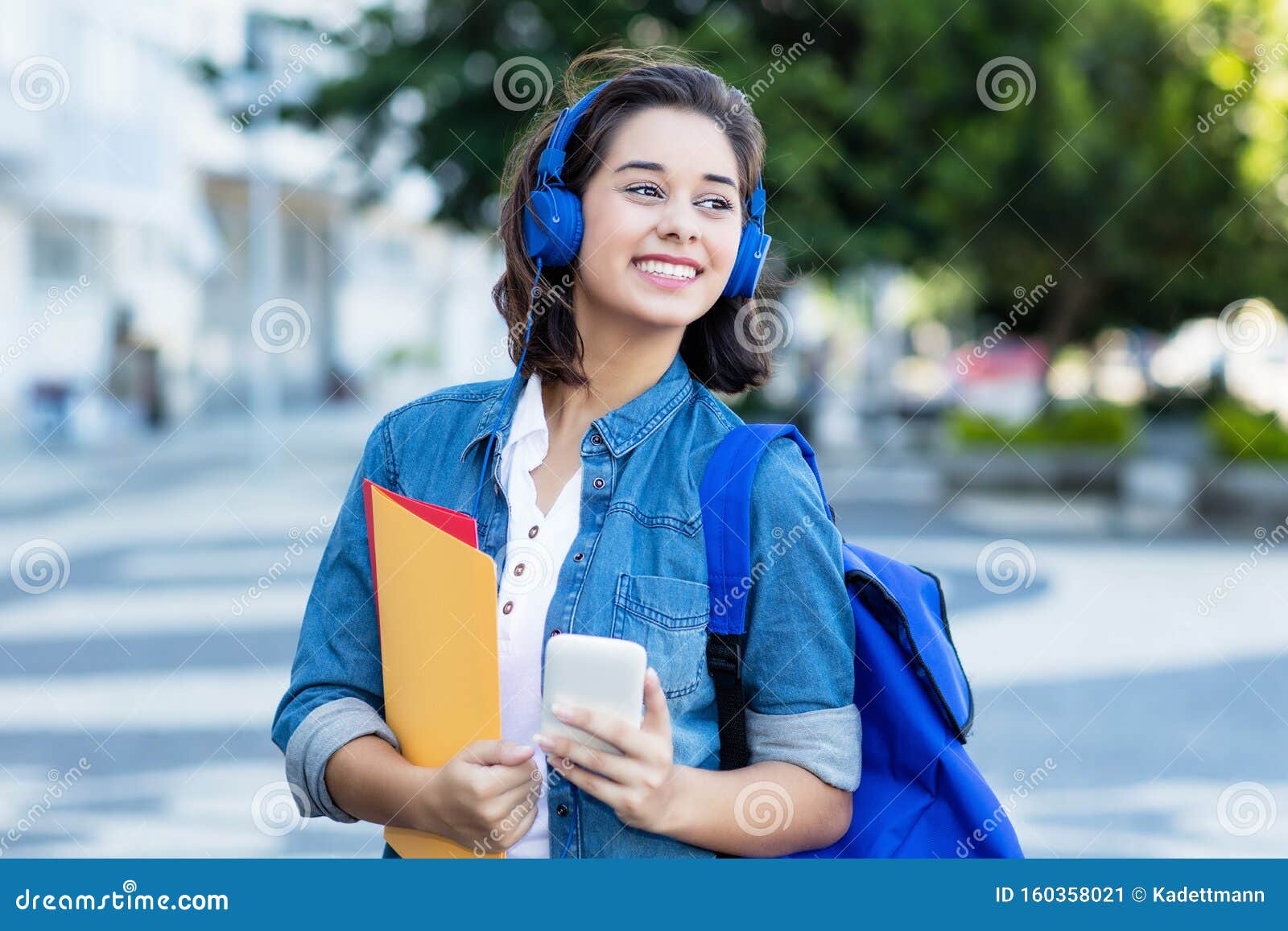 Cute Spanish Female Student with Backpack and Earphones Fotografering ...