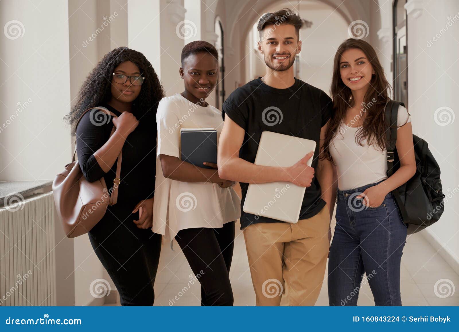Four Mixed-race Students Looking at Camera in College Hall 库存照片 - 图片 包括 ...
