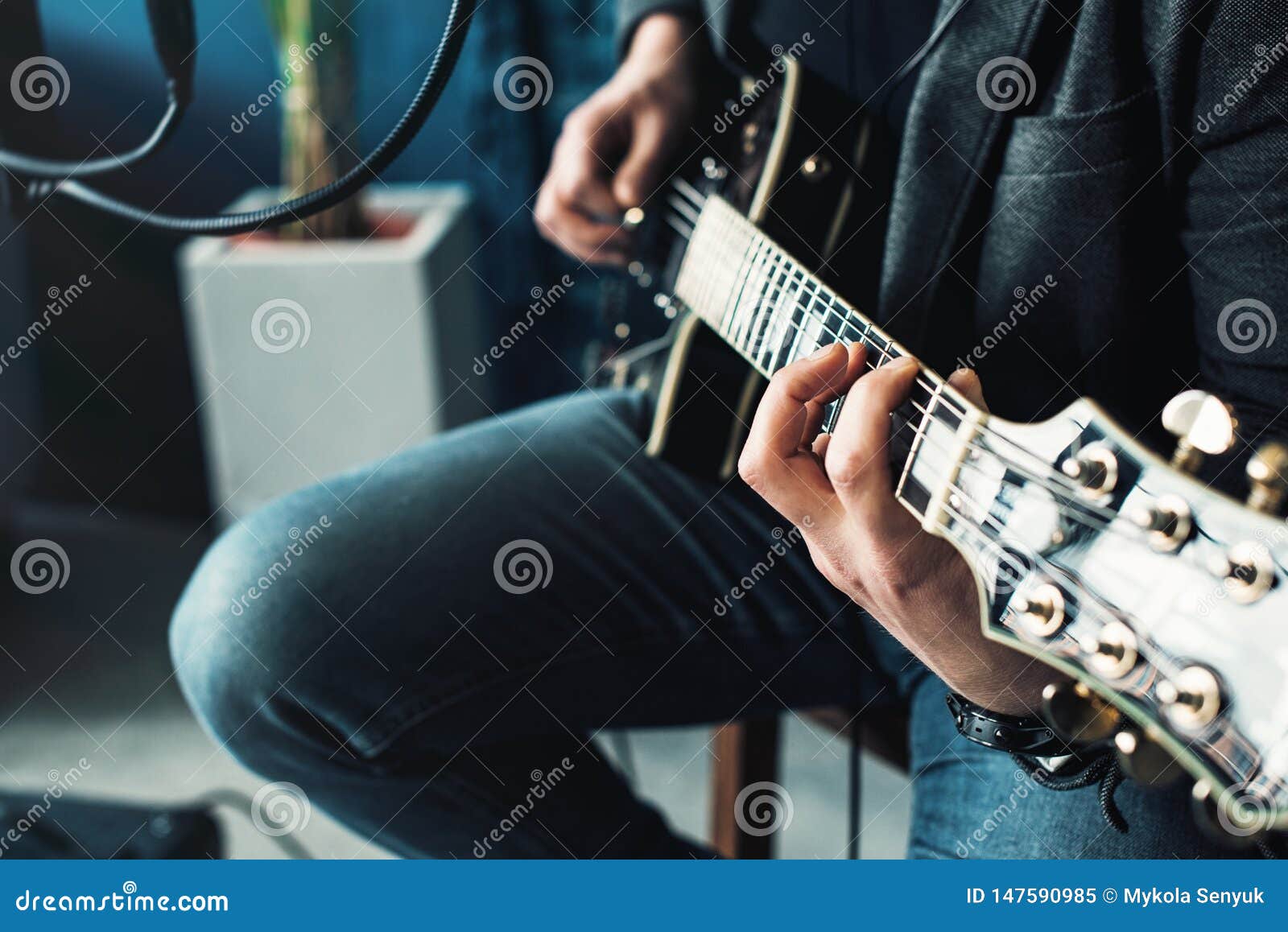 Close Up of a Man Singer Sitting on a Stool in a Headphones with a ...