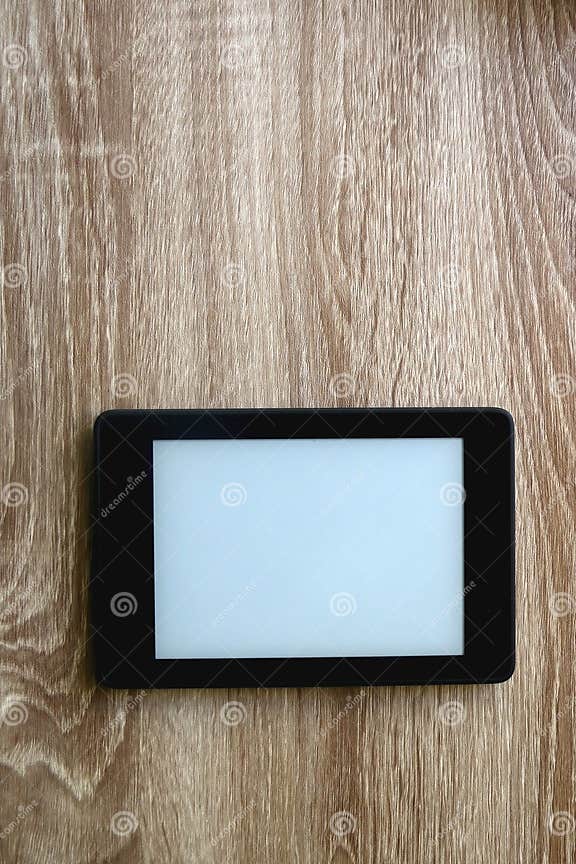 E-Reader on Wooden Background Stock Photo - Image of ebook, screen ...