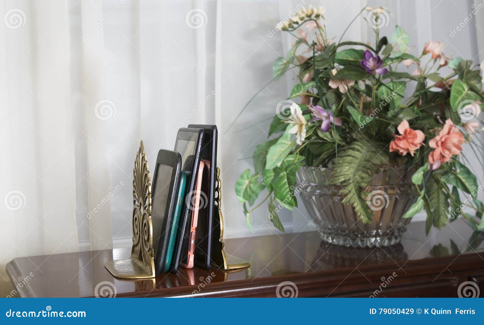 E Readers between Bookends stock image. Image of book - 79050429