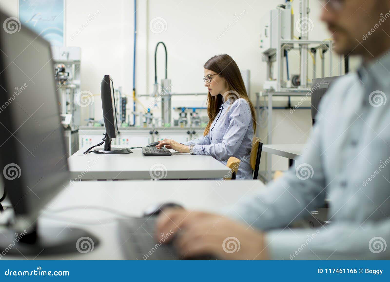 Side View of Focused Students Using Desktop Pc in Classroom Stock Photo ...
