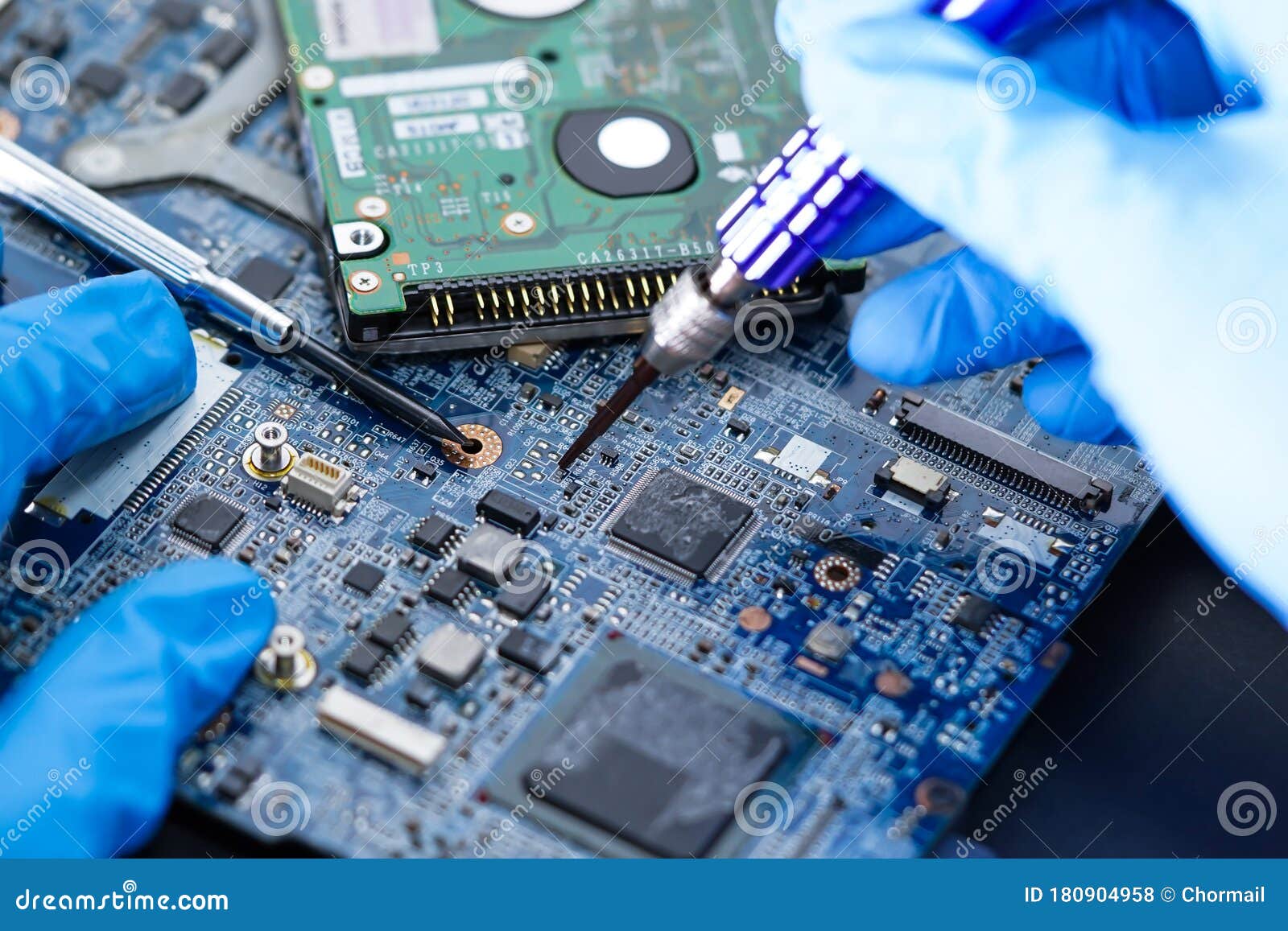 E-waste, Technician Repairing Inside of Hard Disk by Soldering Iron ...