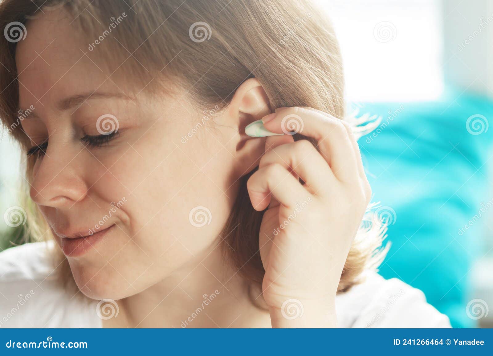 Ear Plugs in the Ears, the Woman Inserts Earplugs before Going To Bed ...