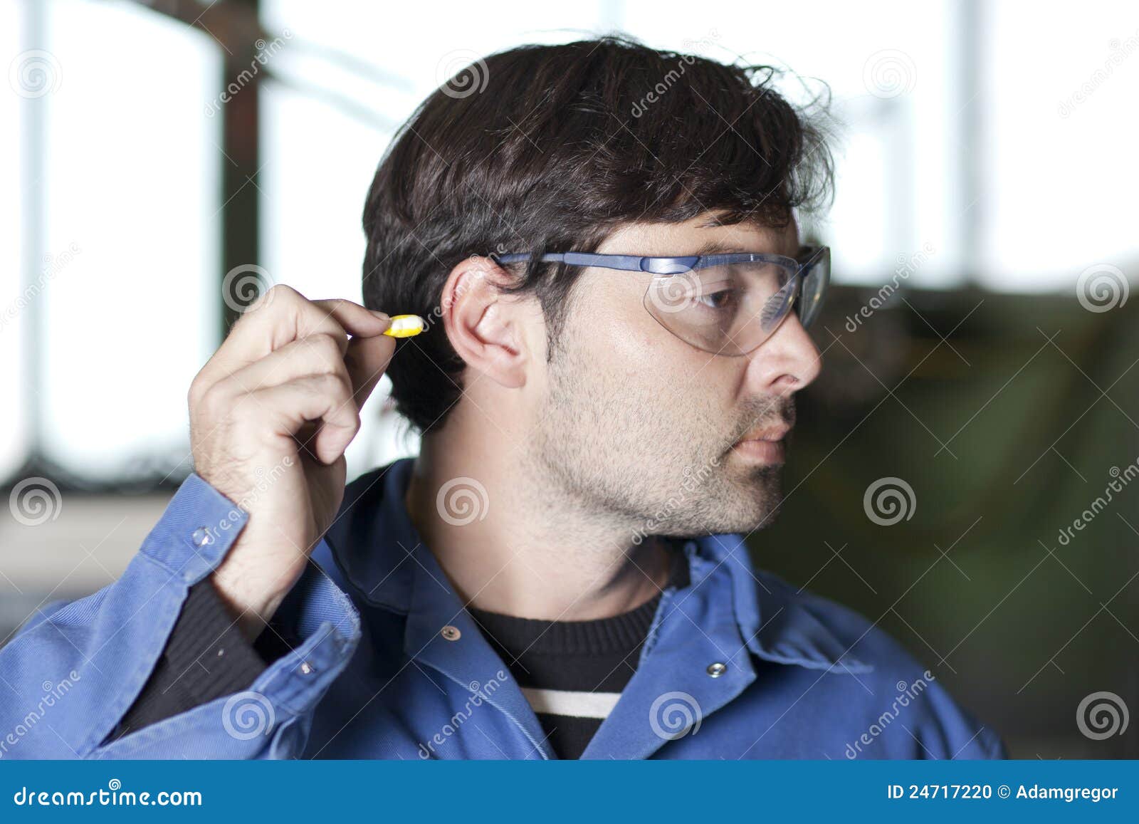 Ear protection at work stock photo. Image of adult, touching - 24717220