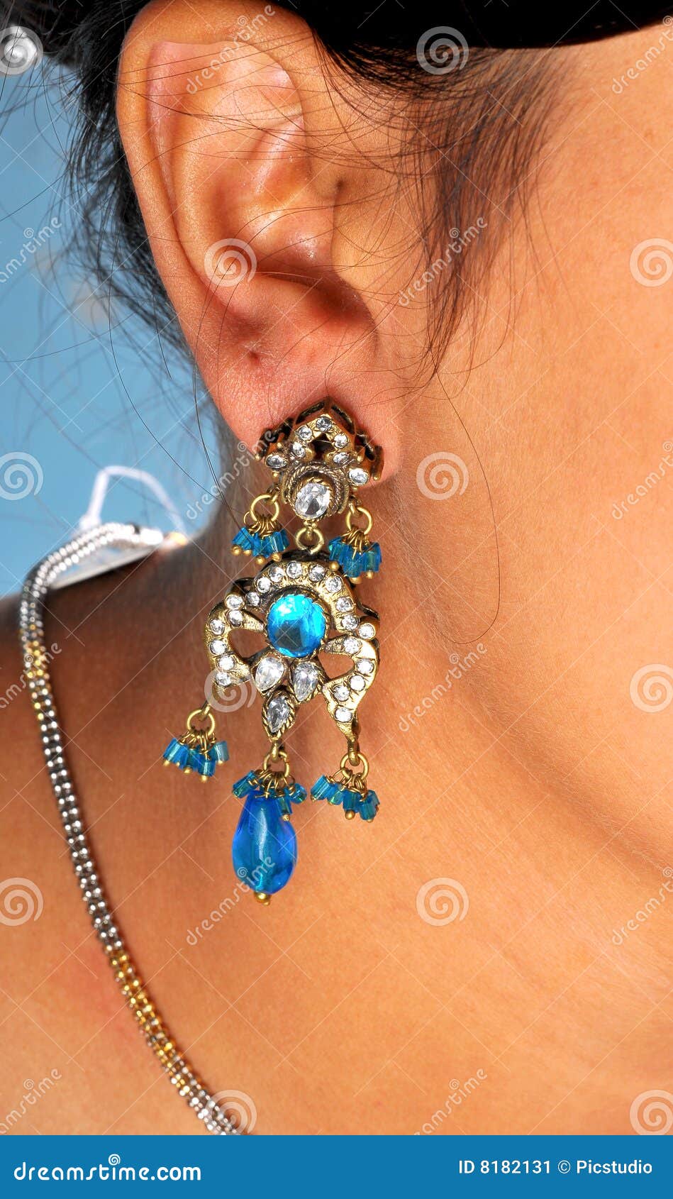 Ear ring stock image. Image of putting, vertical, gold - 8182131