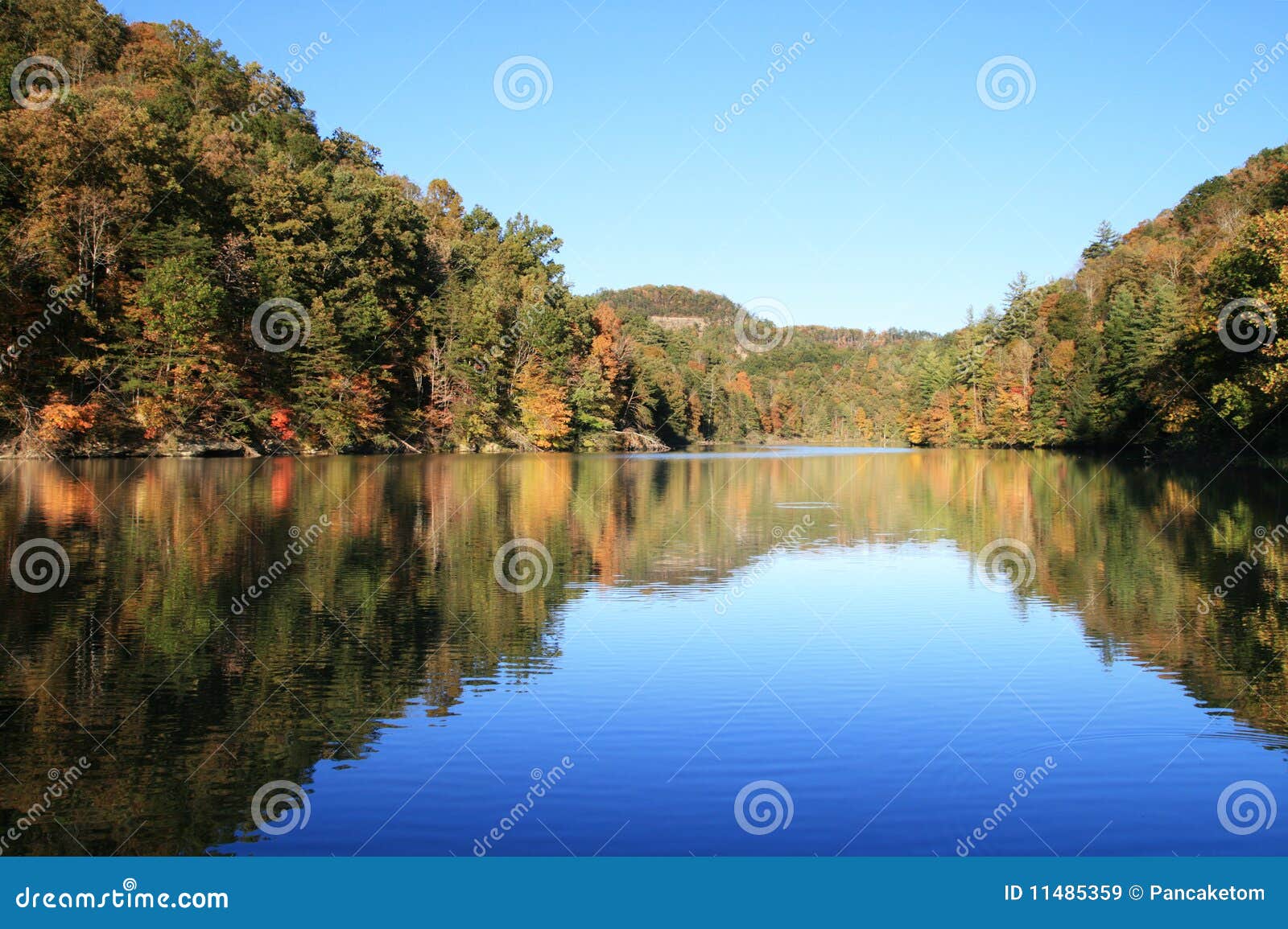 Early fall lake reflection stock image. Image of bridge - 11485359